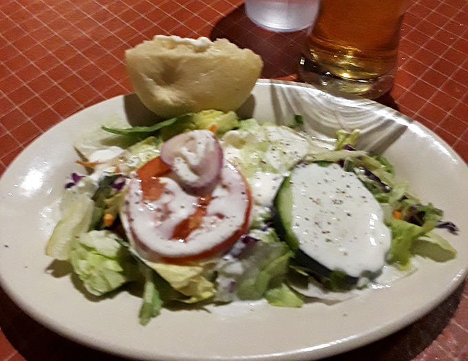 Even the salads at El Corral seem to whisper, "Go ahead, enjoy me now... you've got a serious rendezvous with beef coming up next."