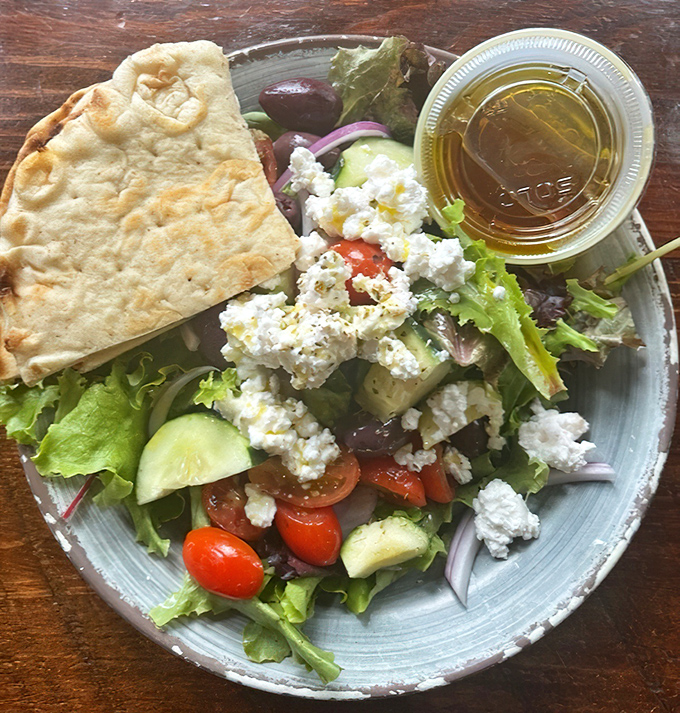 This Greek salad is what vegetables dream of becoming when they grow up. Feta, olives, and that golden olive oil dressing—a Mediterranean vacation on a plate.