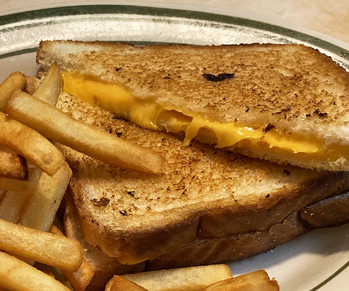 The humble grilled cheese elevated to art form—golden, crispy exterior giving way to that perfect cheese pull that dreams are made of.