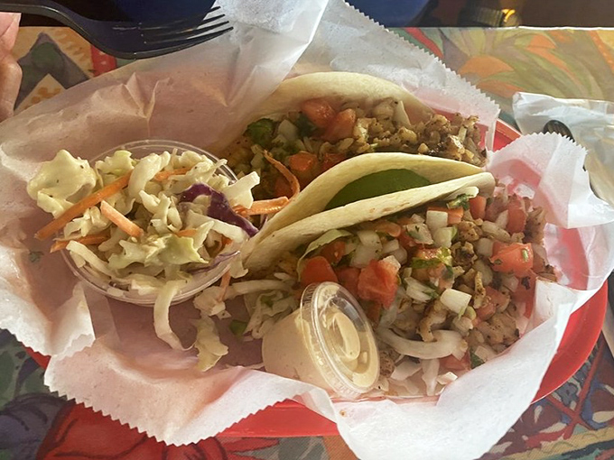 Tacos that understand their mission: deliver fresh ingredients with minimal fuss and maximum flavor. The slaw adds crunch, the sauce adds zing.