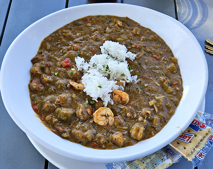 Gumbo so authentic it should come with a Louisiana passport. Dark roux, plump shrimp, and that perfect rice island in a sea of flavor.