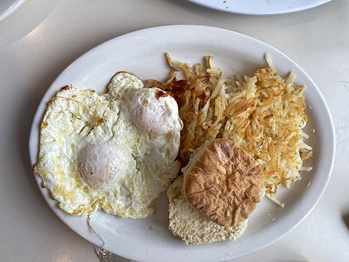Eggs and hash browns—the Fred Astaire and Ginger Rogers of breakfast, dancing together in perfect, golden-crisp harmony. 