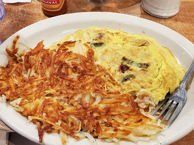 An omelet that's dressed for success with a side of hash browns so perfectly crispy they deserve their own fan club.