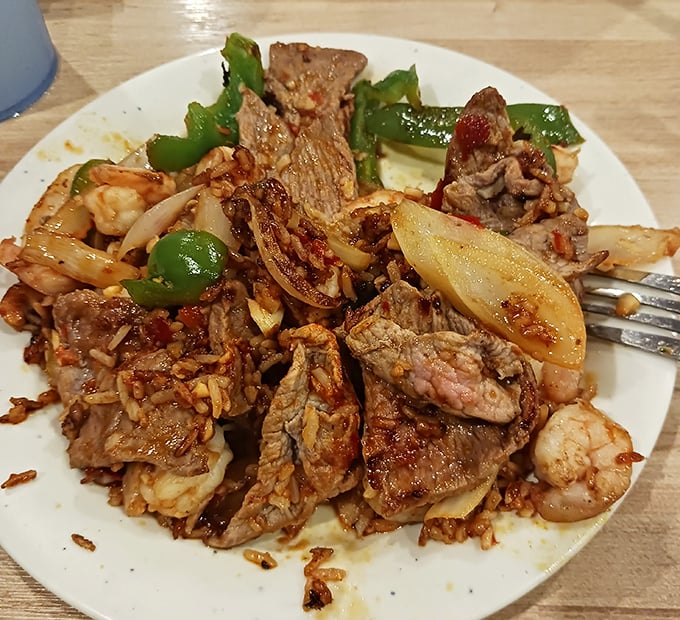 The hibachi chef's masterpiece – a sizzling symphony of beef, shrimp, and vegetables that makes you wonder why you ever bothered with frozen stir-fry at home.