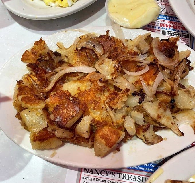 These aren't just home fries—they're a crispy, onion-flecked masterclass in potato perfection that would make your grandmother nod in approval.