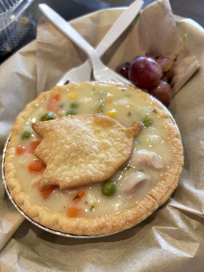 Chicken pot pie that would make your grandmother both proud and jealous – golden crust, creamy filling, and that adorable little pastry leaf on top!