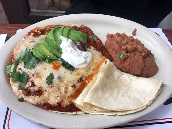 Huevos rancheros that would make your abuela proud – a fiesta of flavors topped with avocado slices that California practically requires by law.