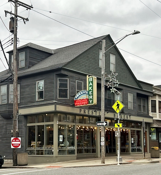 The corner location with its wraparound windows invites passersby to surrender to temptation—resistance is futile when Italian pastries are involved.