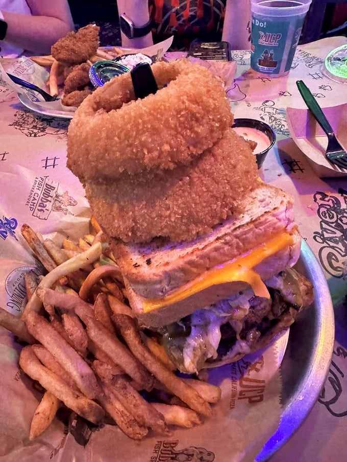 They call it the Kitchen Sink burger because apparently everything delicious decided to show up at once.