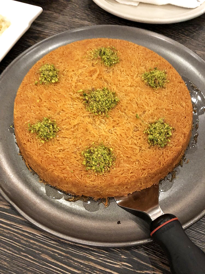 Konafa that would make any grandmother proud – golden, crispy strands hiding a sweet secret. Dessert doesn't get more hypnotic than this.