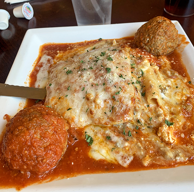 This lasagna and meatballs combo isn't just comfort food—it's a warm hug from an Italian grandmother you never knew you had.