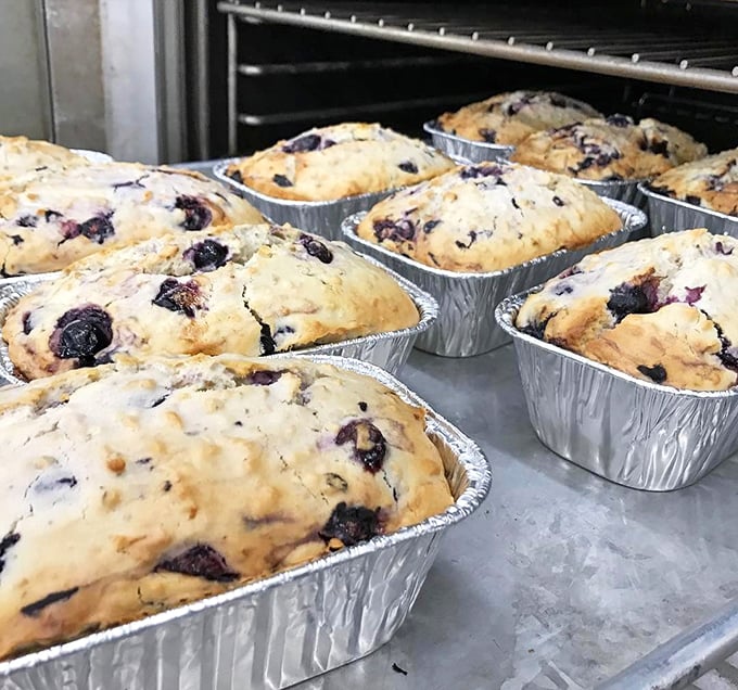 Fresh-baked blueberry breads cooling in their tins—the baker's version of a family portrait. Each one uniquely beautiful, equally tempting.