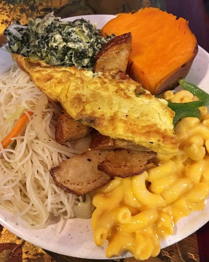 The buffet's United Nations of comfort food – mac and cheese neighbors rice noodles while sweet potato stands as neutral territory.