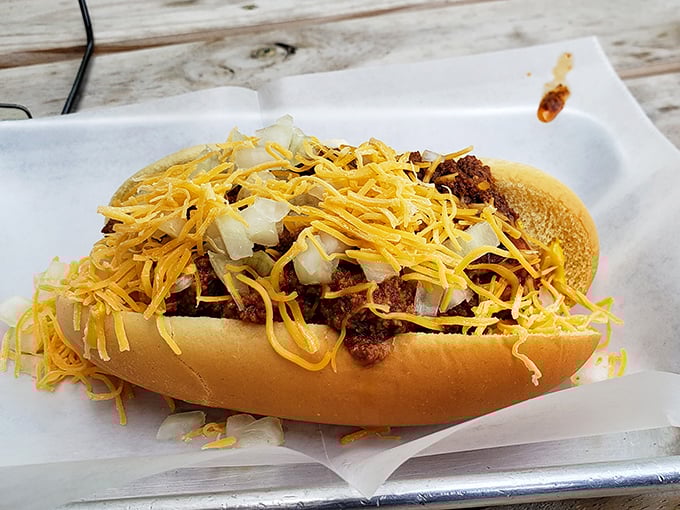 This isn't just a chili dog—it's comfort food architecture with layers of beef, cheese, and childhood memories in every bite.