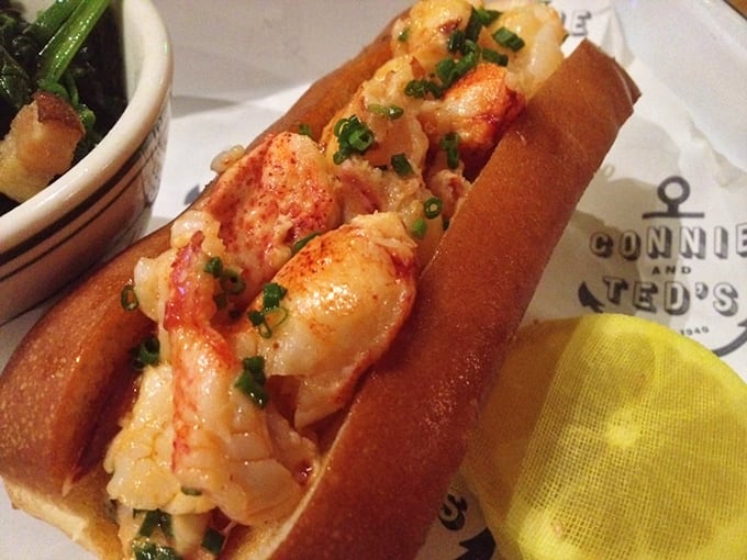 Lobster roll perfection: sweet chunks of lobster nestled in a buttery split-top roll—the kind of sandwich that demands silence while eating, broken only by involuntary sighs.