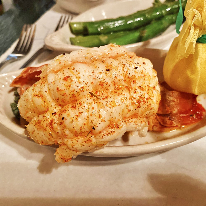 This lobster tail isn't just seafood – it's an oceanic celebration on a plate, perfectly seasoned and ready to be dunked in that clarified butter.
