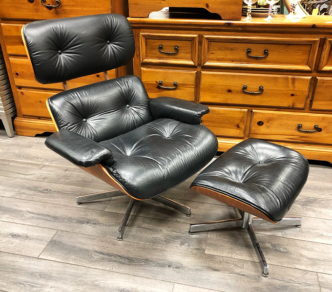 The holy grail of mid-century modern: an Eames-style lounge chair and ottoman. It's not just furniture—it's a statement that says, "Yes, I have excellent taste."