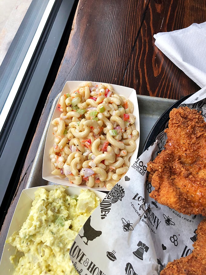 Creamy macaroni salad and potato salad alongside that legendary chicken. The sides here aren't afterthoughts—they're co-stars.