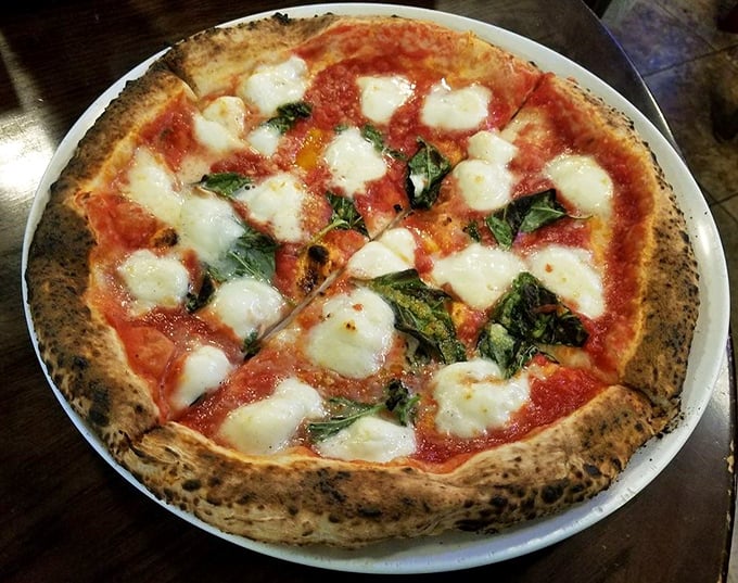 The Margherita pizza—pizza's equivalent of the little black dress. Timeless, elegant, and always the right choice for any occasion. 