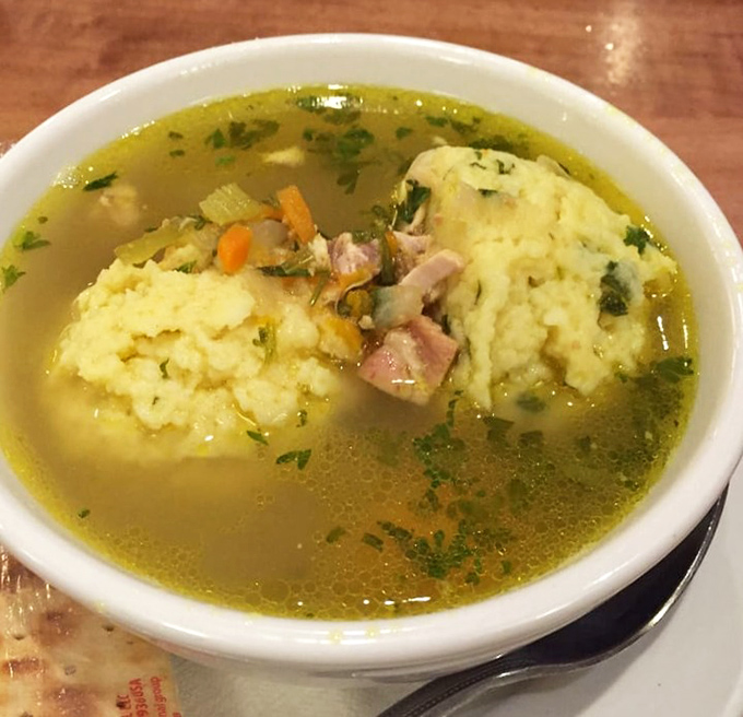 Those matzo balls are floating like delicious life preservers in a golden sea of comfort.