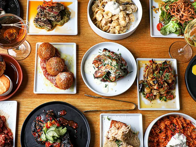 A tabletop feast that makes decision-making impossible. When everything looks this good, FOMO becomes a legitimate dining condition.