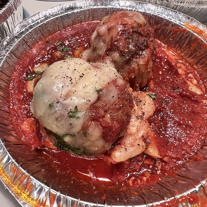 These meatballs aren't just swimming in sauce—they're doing the backstroke in a pool of flavor that would make any Italian grandmother proud.