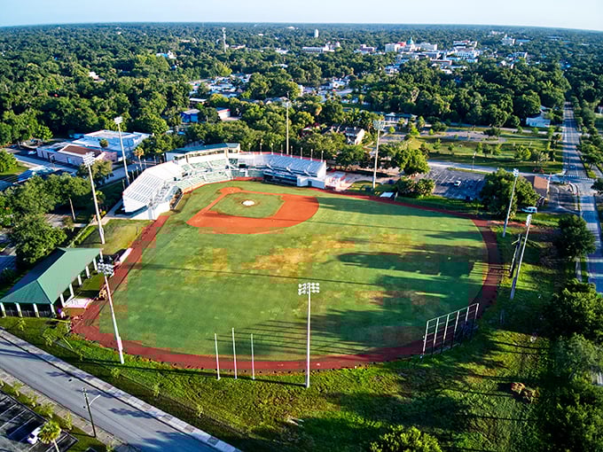 Melching Field from above looks like a perfect emerald set in DeLand's verdant landscape. Baseball as it should be—intimate, green, and surrounded by trees.