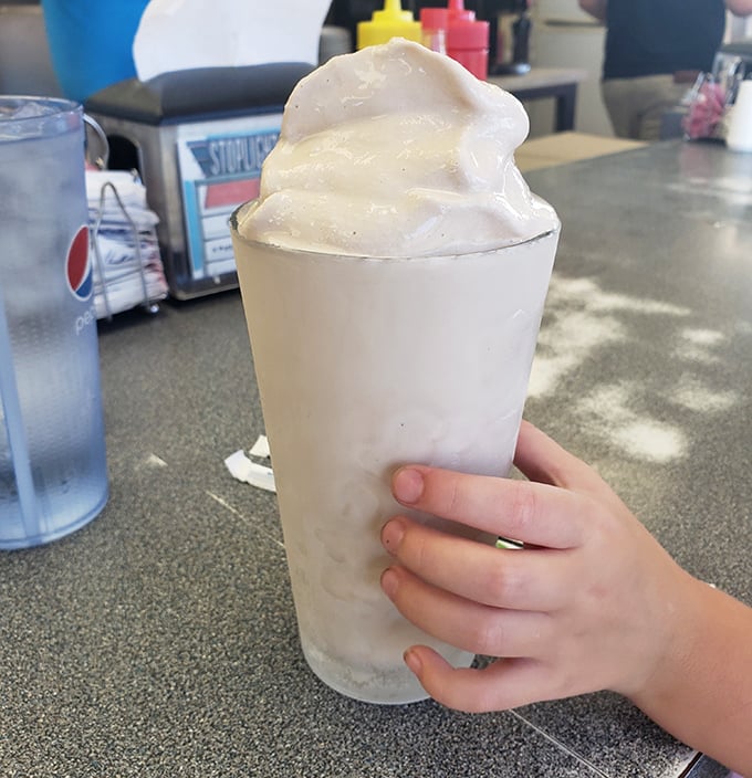 A milkshake so thick it laughs at straws. This vanilla cloud requires commitment, patience, and possibly a spoon backup plan.