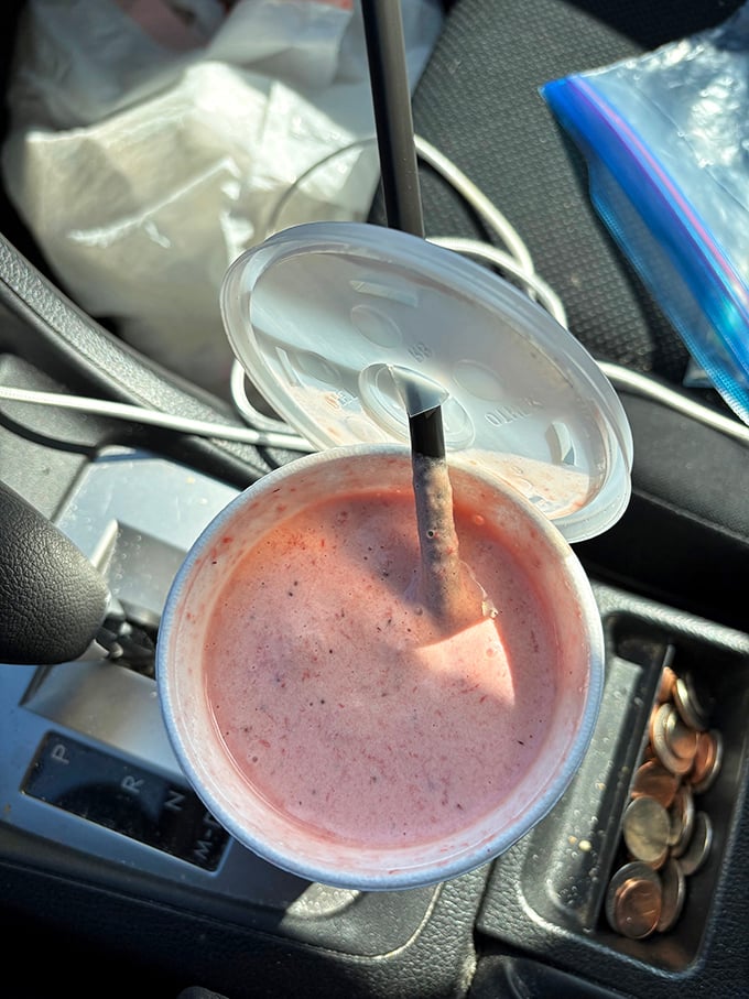 This strawberry milkshake isn't just a drink, it's a portable celebration. The car cupholder has never held something so worthy.