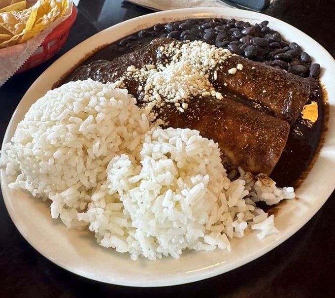 Rice so perfectly cooked it deserves its own spotlight, alongside mole enchiladas that balance sweetness and spice like old dance partners.