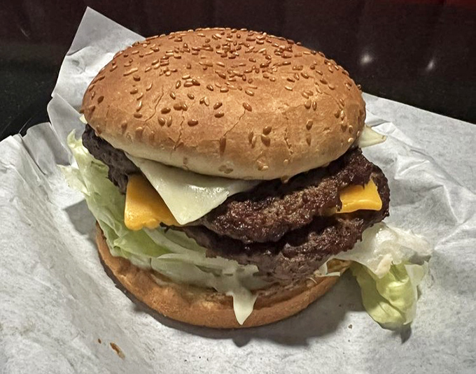 The Monster Burger lives up to its name – a towering achievement that makes other burgers look like sliders.
