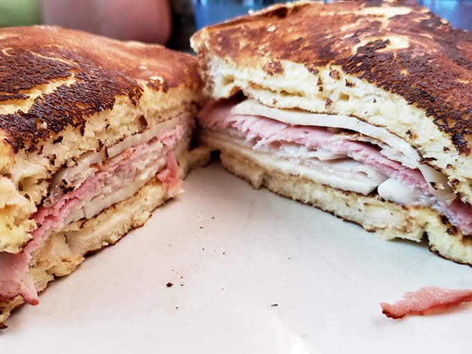 The Monte Cristo: where French toast meets ham meets Swiss cheese meets your new obsession. Cut in half to reveal its glorious stratified layers of comfort.
