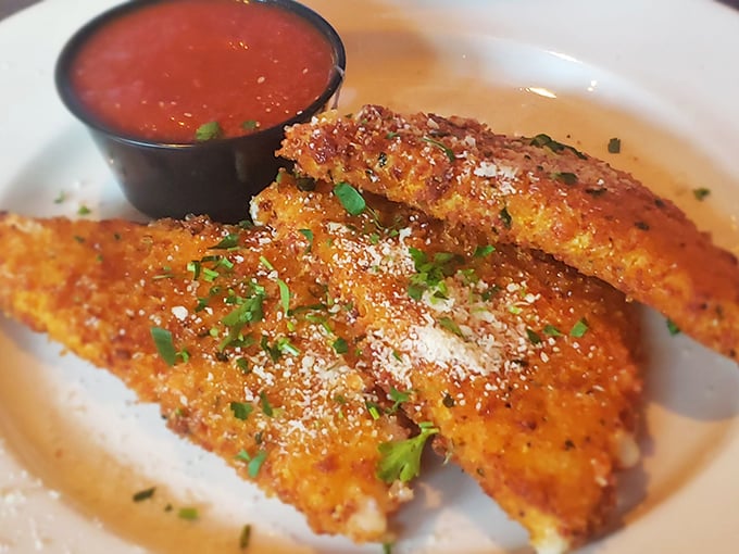 Fried mozzarella sticks that shatter with purpose, revealing that perfect cheese pull that belongs in the Olympics of comfort food.