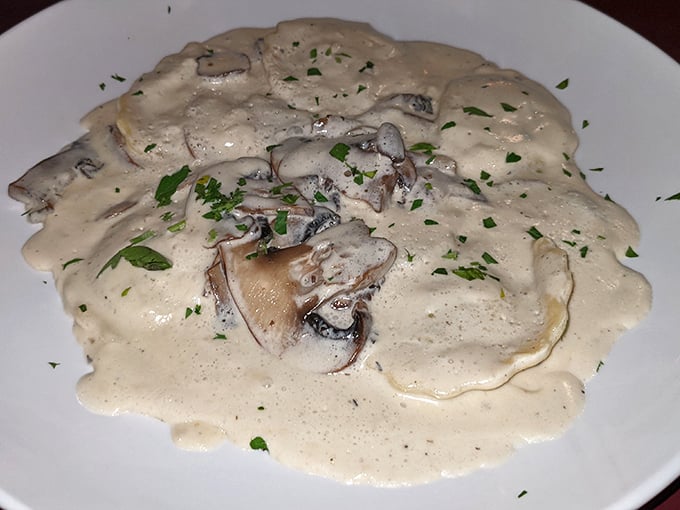 Mushroom ravioli swimming in cream sauce—proof that fungi can indeed be your best friends at dinner.