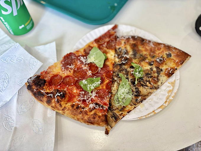 Two slices that showcase the art of contrast—pepperoni's spicy punch meets mushroom's earthy depth. The pizza version of a beautiful duet. 