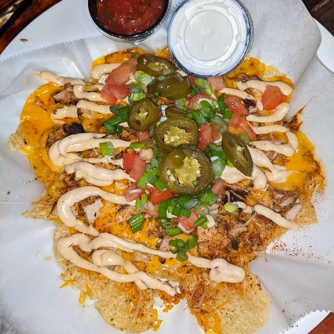 These loaded nachos aren't just a dish—they're an architectural achievement that demands to be demolished with friends.