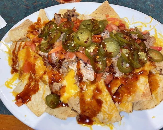 BBQ nachos that blur the line between appetizer and main event – where pulled pork, jalapeños, and melted cheese create a beautiful mess worth every napkin.