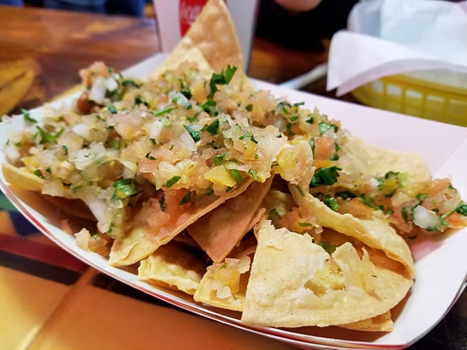 Loaded nachos crowned with cheese, jalapeños, and fresh toppings create the ultimate shareable indulgence.