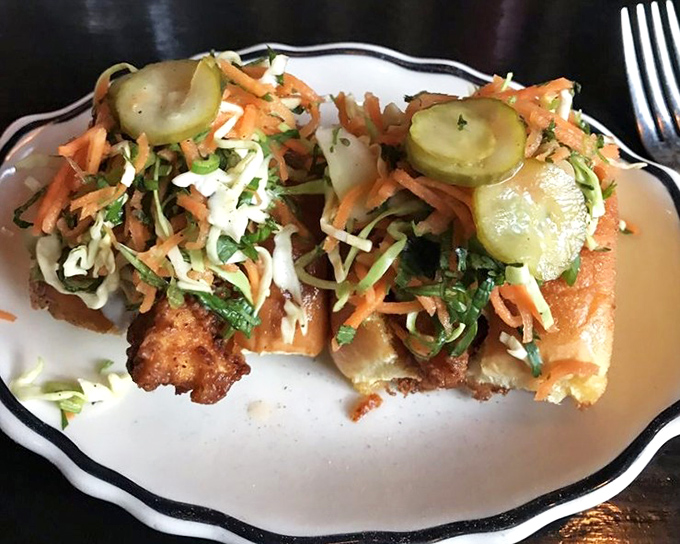 Nashville Hot Buns bring the heat in the most civilized way possible – nestled in pillowy steamed buns with cooling slaw to tame the flame.