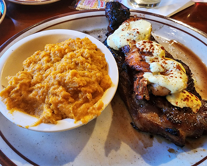 When a New York strip comes topped with seafood and paired with sweet potato mash, it's not just dinner—it's a celebration on a plate.