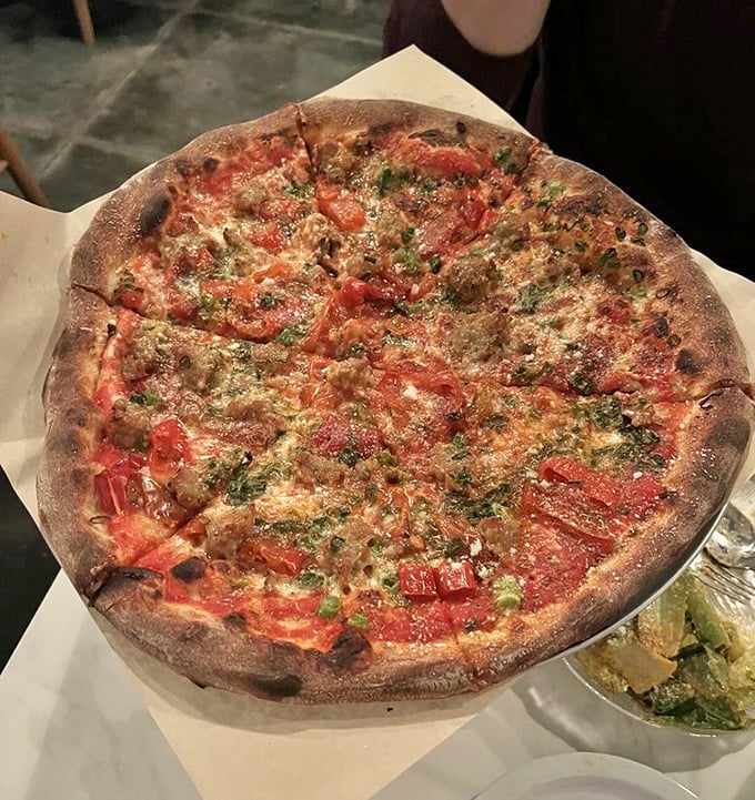 The Old Faithful lives up to its name—fennel sausage and those glorious Mama Lil's peppers creating a harmony that would make even Mozart weep with joy.