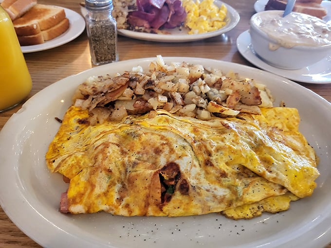 This omelet doesn't need a fancy French name to tell you it means business – folded perfection that's fluffy, filled, and fundamentally fantastic.