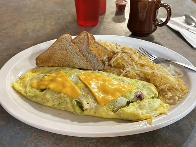 An omelet that proves breakfast is the most honest meal of the day – straightforward, satisfying, and impossible to resist.