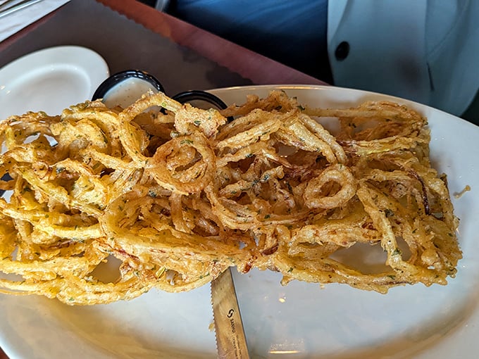 The onion loaf isn't just an appetizer—it's an engineering marvel. Crispy, golden layers stacked higher than a Wisconsin winter snowdrift.