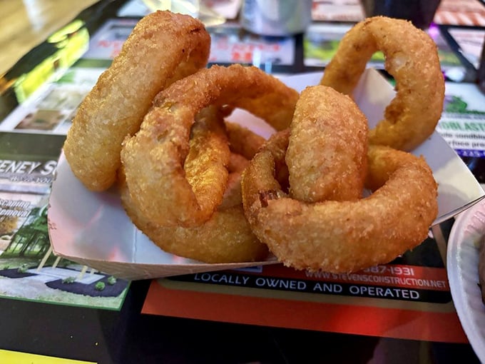 Onion rings with the perfect crunch-to-softness ratio – the kind that make you wonder if vegetables were actually put on earth just to be battered and fried.