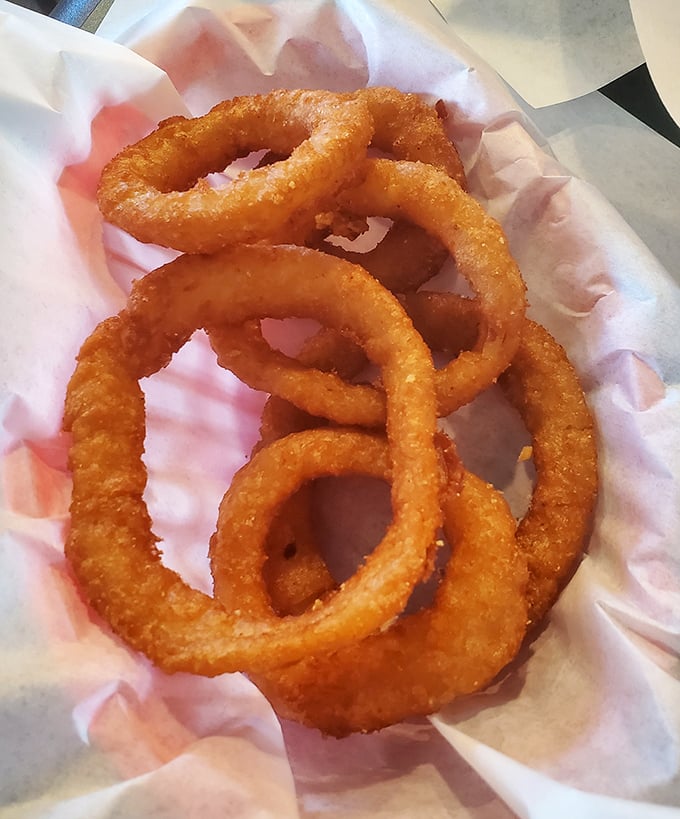 Onion rings that shatter with satisfying crispness. These golden halos aren't just sides—they're the supporting actors that deserve their own Oscar.