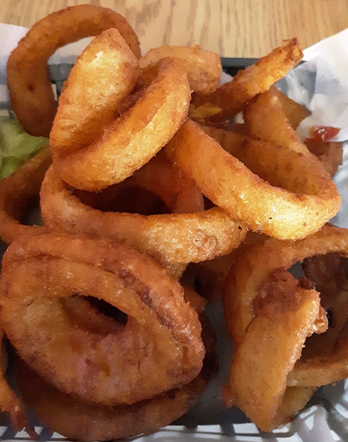 These aren't your average onion rings—they're golden halos of happiness that make you wonder why anyone bothers with those frozen imposters.