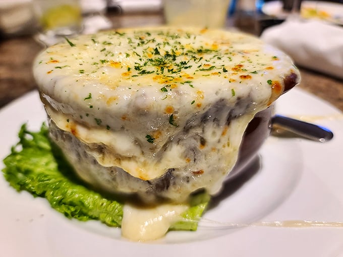 This French onion soup isn't messing around – the cheese pull alone deserves its own Instagram account and possibly a small parade.