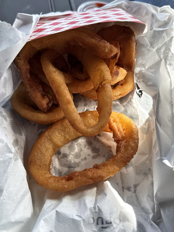 These onion rings aren't just fried food—they're golden halos of happiness. Crispy exterior, tender interior, and worth every calorie.