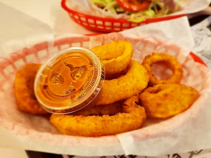 Golden-fried onion rings with that perfect crunch-to-softness ratio—the supporting actor that sometimes steals the whole show.
